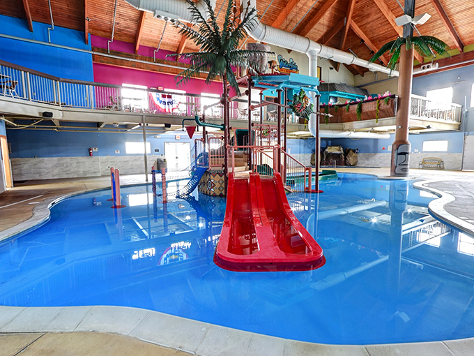 The water slide complex stands like a colorful monument to joy, promising thrills regardless of what season it is outside.