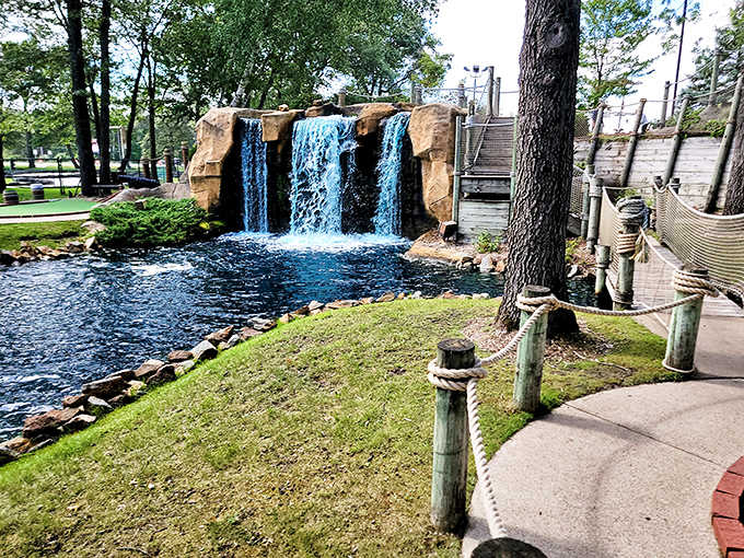 Cascading waters create nature's soundtrack, turning missed putts into dramatic moments against a backdrop of perpetual tranquility.