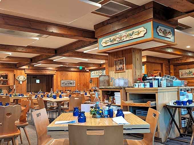 Interior: Warm wooden beams, heart-cutout chairs, and traditional Scandinavian charm create the perfect setting for lingonberry-fueled feasting.