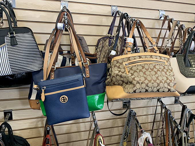 Designer handbags line the wall like trophies of fashion hunts past, each authenticated and priced at wallet-friendly figures.