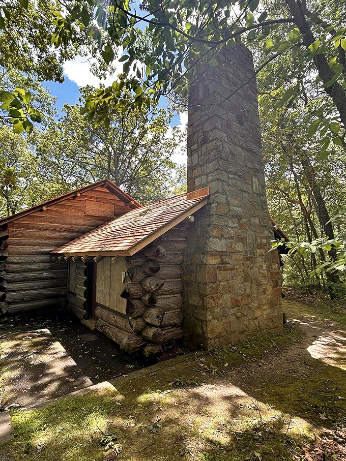 Not your average woodland cabin. This stone-chimneyed relic whispers stories of Gatsby-esque garden parties from Michigan's gilded automotive age.