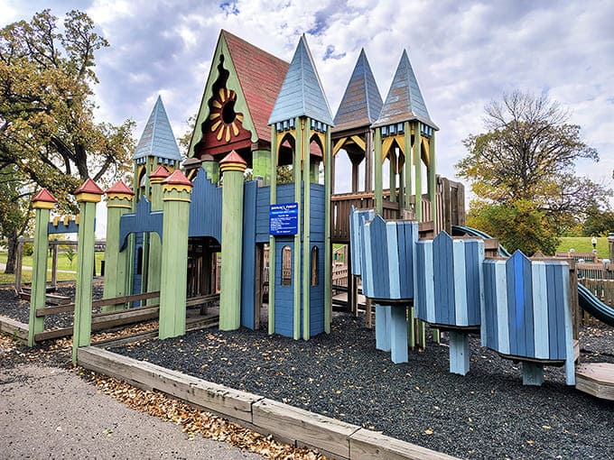 Colorful architectural details pop against natural wood, showcasing the thoughtful design that transforms simple materials into a magical kingdom for play.