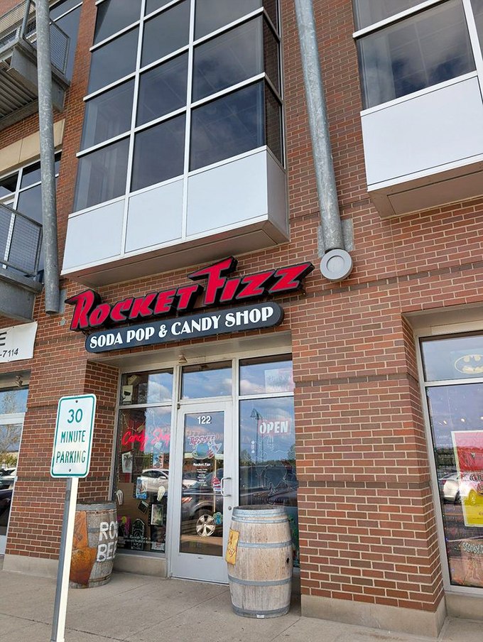 Those wooden barrels flanking the entrance aren't just decoration, they're sentinels guarding the portal to a land where adulting is temporarily suspended.