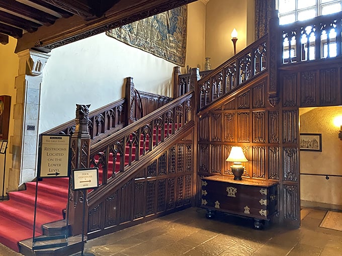 The grand staircase at Meadow Brook Hall &ndash; where even your ascent to find the bathroom feels like a royal procession.