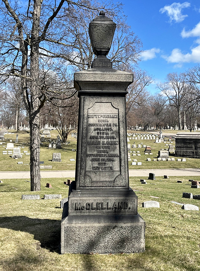 The McClelland family monument stands as a silent sentinel, its weathered inscription telling tales of Detroit's bygone era.