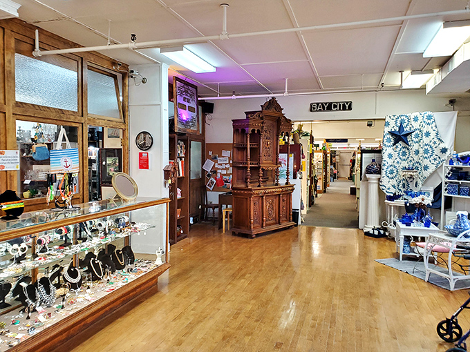 Polished wooden floors and gleaming display cases create pathways through history, each aisle offering new discoveries for eagle-eyed treasure hunters.