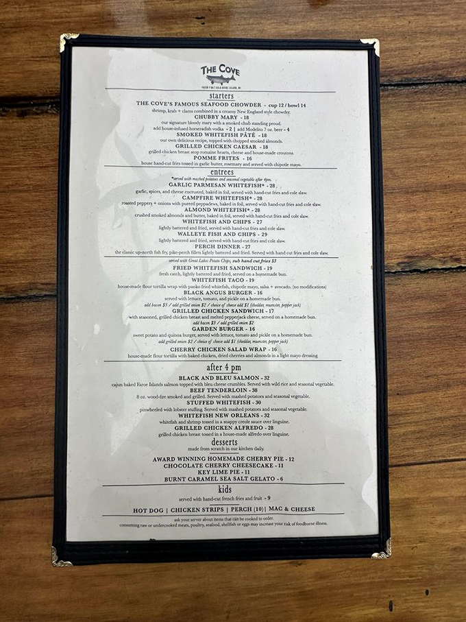 The Cove's menu reads like a love letter to Great Lakes cuisine, featuring their famous seafood chowder, whitefish prepared multiple ways, and homemade cherry pie.