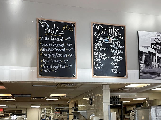 The chalkboard menu showcases a parade of pastry possibilities, from butter croissants to almond angel puffs, each more tempting than the last.