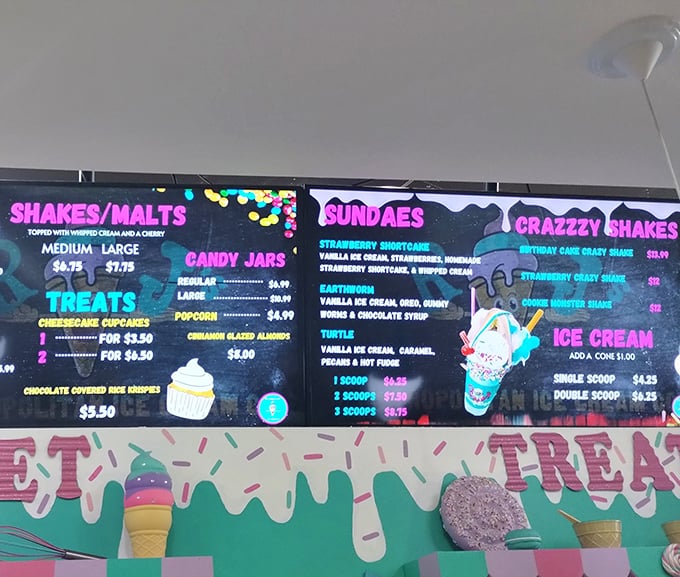 The illuminated menu board glows with temptation, offering a roadmap to deliciousness that makes choosing just one item a delightful form of torture.
