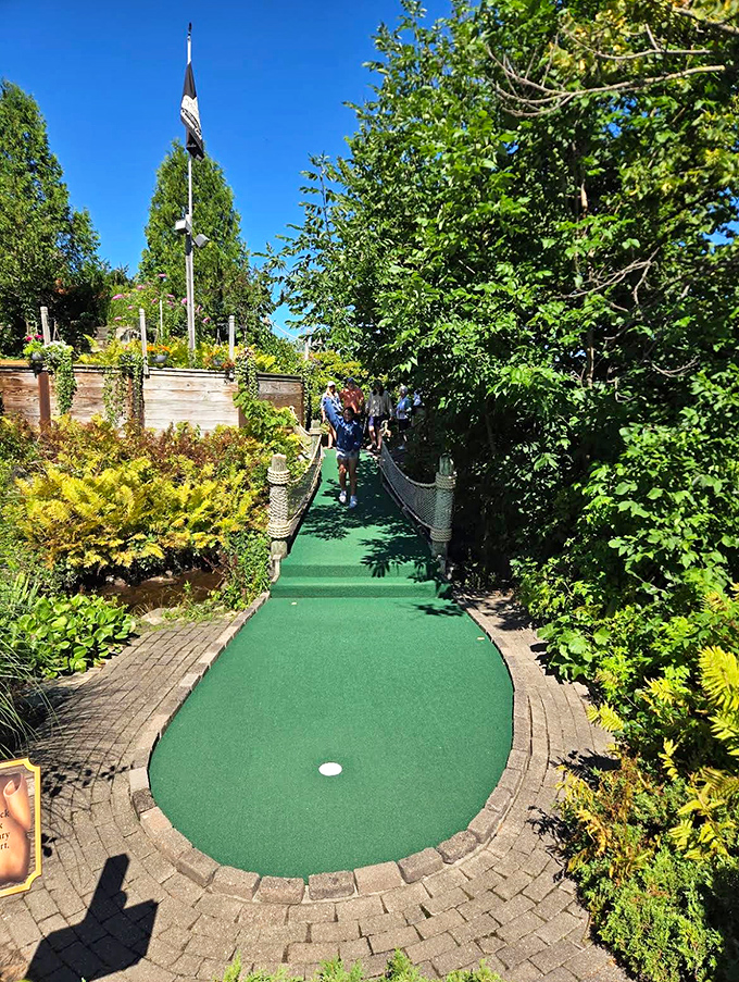 Nature creates the perfect frame for this putting paradise, where the green path winds between lush plantings like a secret passage to treasure.