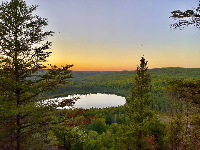 Oberg Lake: Sunset paints the sky in pastels above this serene lake, where even the clouds pause their journey to admire the view.