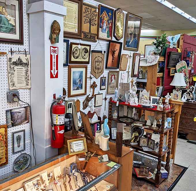 Religious artifacts and artwork create a reverent corner amidst the bustling marketplace &ndash; each piece carrying its own spiritual history.
