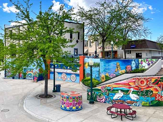 The "Riverside Voices" mural transforms downtown with vibrant colors and wildlife imagery, proving this town's creativity flows as freely as its namesake river.
