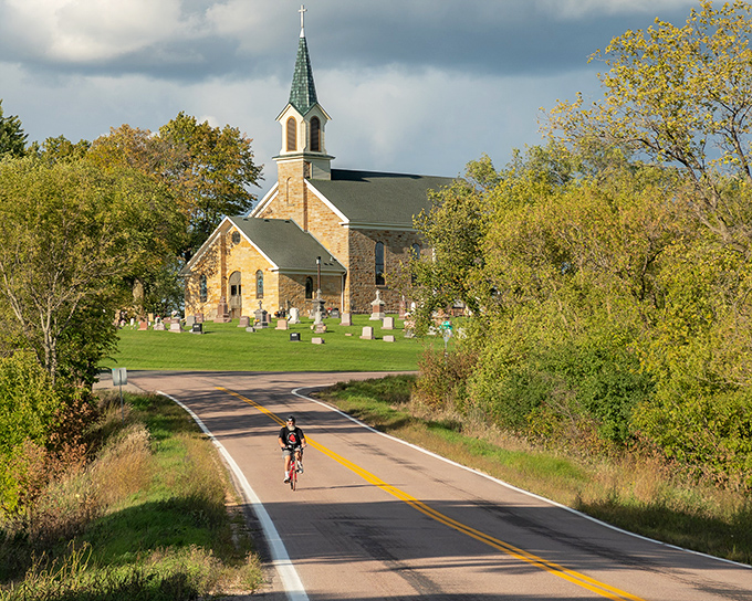 St. Patrick's Church stands sentinel over country roads, its limestone walls and steeple a spiritual landmark for cyclists and Sunday drivers alike.