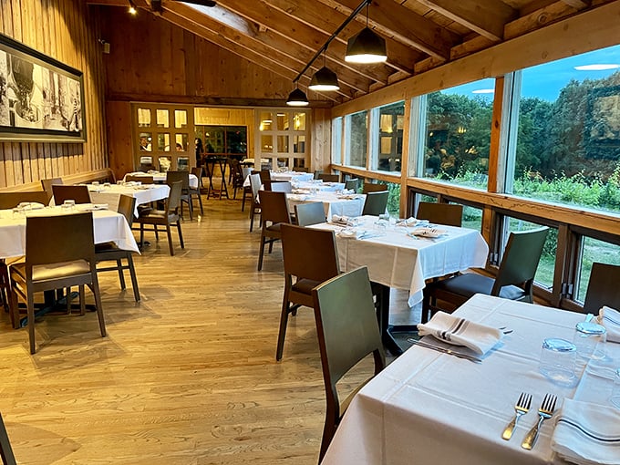 Elegant simplicity defines Tabor Hill's dining room, where floor-to-ceiling windows bring vineyard views tableside as you savor local flavors and wines.