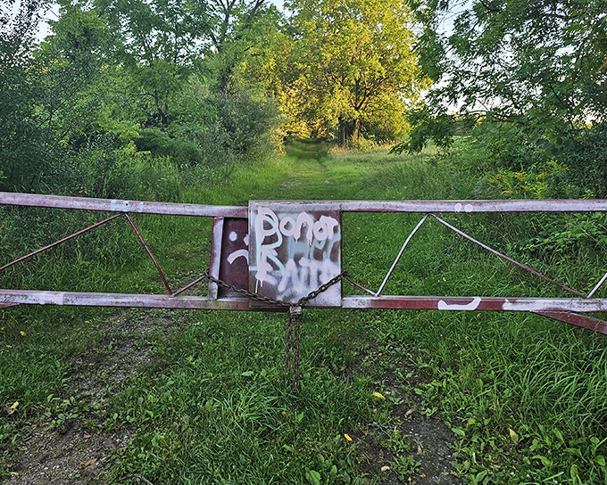 This weathered gate stands sentinel between the ordinary world and whatever mysteries lie beyond on Seven Gables Road.