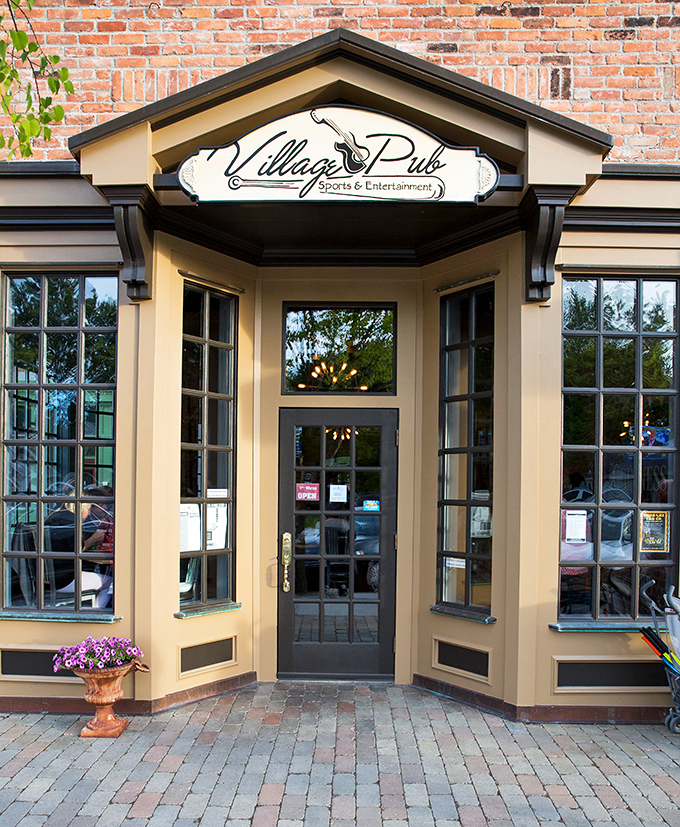 Village Pub: Where locals and visitors mingle over craft beers and lake-fresh perch, all served with a side of genuine Michigan hospitality.