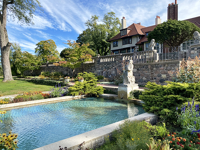Gardens cascade down stone terraces, creating a multi-level paradise where water features and blooms compete for your attention.