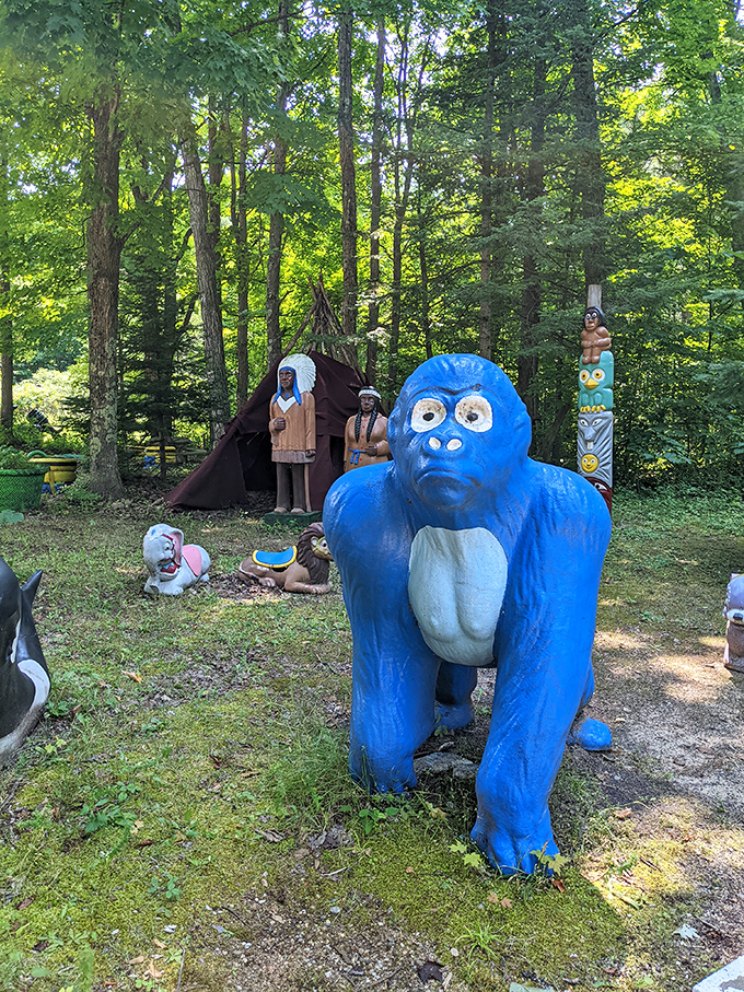 This azure ape looks like he's contemplating the meaning of life while his woodland friends hold a tribal meeting nearby.