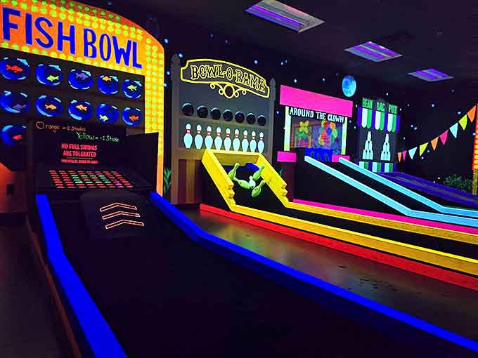 Bowling Game Area Who knew knocking down glowing pins could be so mesmerizing? This clever hole transforms the traditional bowling alley into a neon playground.