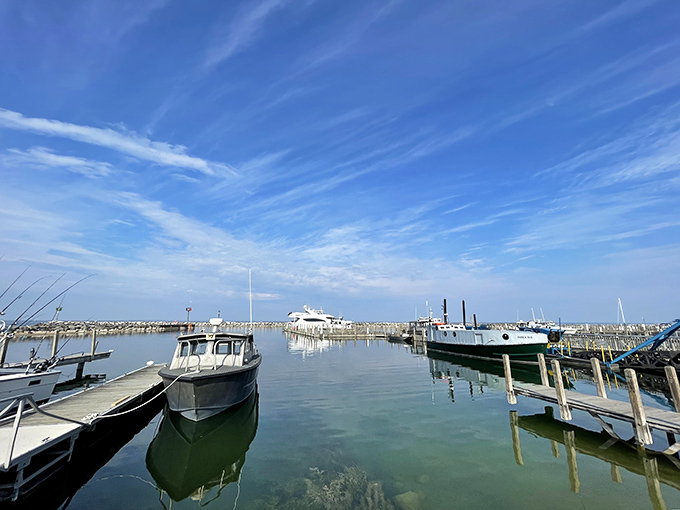 Water so calm and clear you can practically see yesterday's worries dissolving into the depths, with boats resting peacefully like they've earned it.
