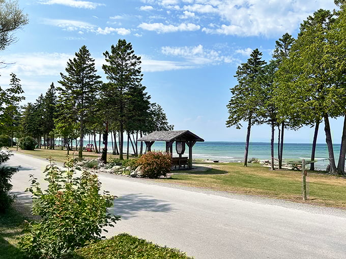 Rustic charm meets lakeside luxury: This wooden gazebo offers a perfect vantage point for watching boats sail by on Lake Huron's crystal waters.