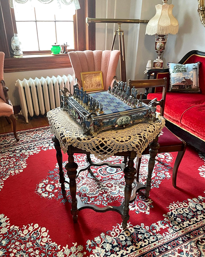 An elegant chess set awaits players in the keeper's parlor, perhaps set up by Captain Townsend's spectral hands for an otherworldly match.