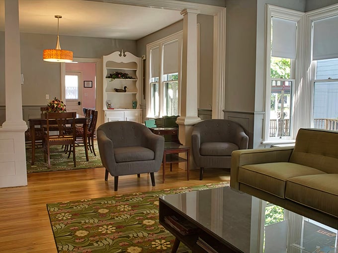 Elegant columns and warm wood floors welcome you into living spaces that balance vintage charm with modern comfort.