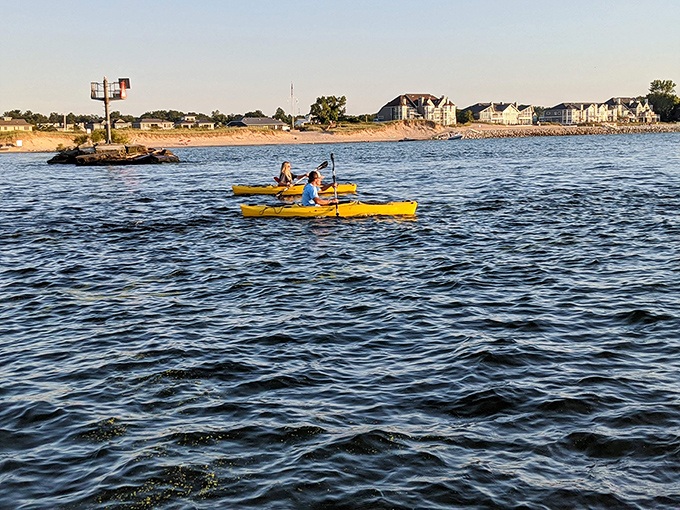 Adventure seekers paddle through the calm waters in bright yellow kayaks &ndash; nature's gym with a view.