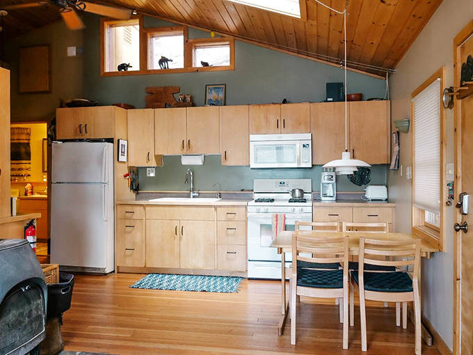 This compact yet efficient kitchen proves you don't need a chef's paradise to create memorable meals with a million-dollar view.