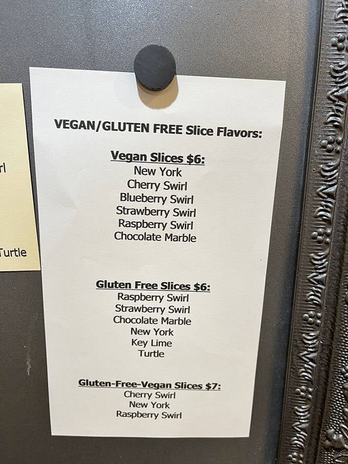 Decisions, decisions! The menu board showcases vegan and gluten-free options that don't sacrifice flavor, proving dietary restrictions needn't mean dessert deprivation.