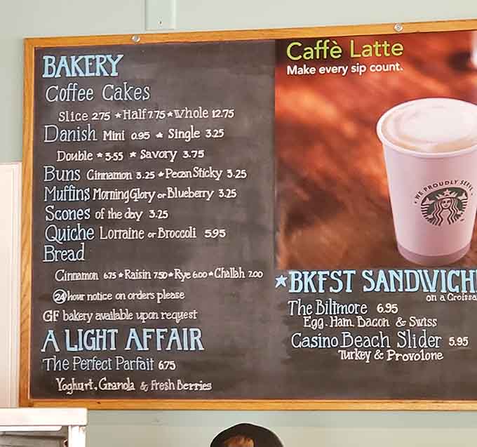 The chalkboard menu offers a tantalizing glimpse of coffee options, each carefully selected to complement the parade of pastries that keeps customers returning.