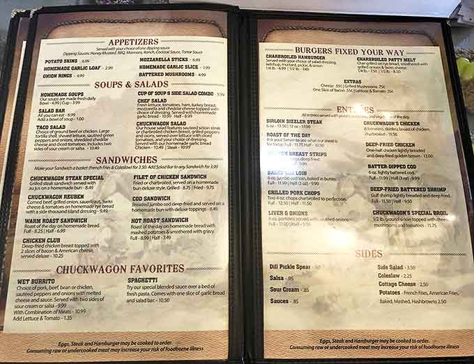 The menu reads like a comfort food manifesto – hearty portions and homestyle favorites dominate these well-worn pages.