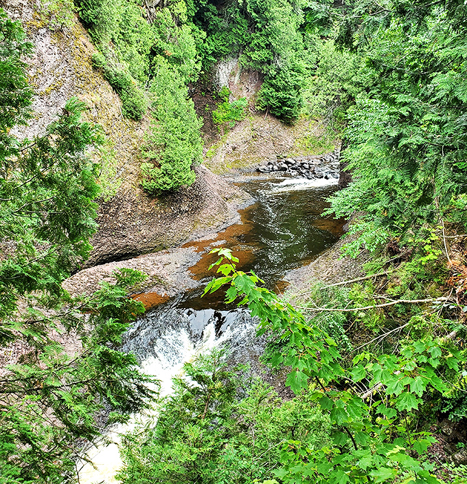 After the rush comes calm &ndash; the Black River settles into a peaceful flow after its dramatic plunge over the falls.