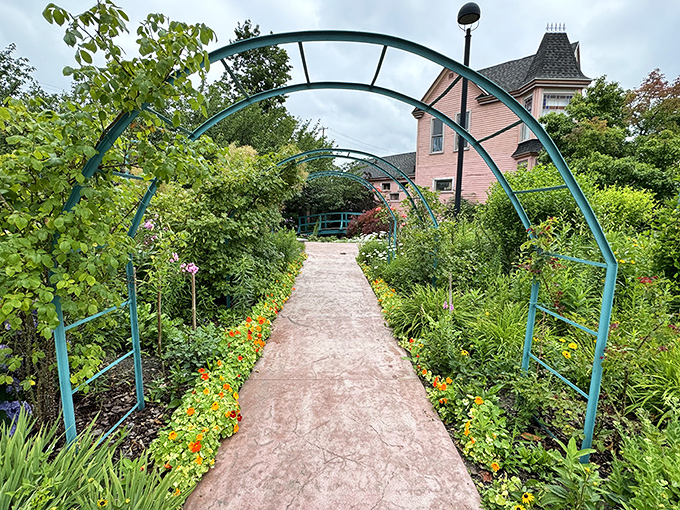 Follow the turquoise arches into another world, where each step down this flower-lined path promises new visual delights.