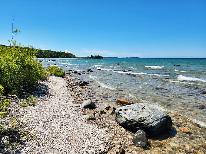 Nature's own zen garden &ndash; smooth stones and gentle waves creating a shoreline symphony for the senses.
