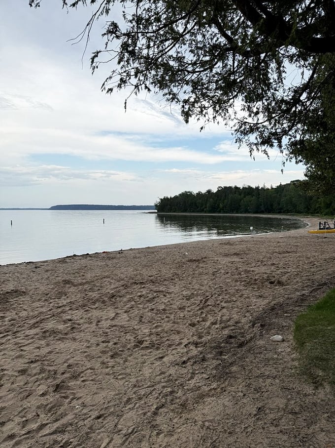 Shoreline serenity at its finest &ndash; where Green Bay's crystal waters meet the sandy beach, creating nature's perfect relaxation station.
