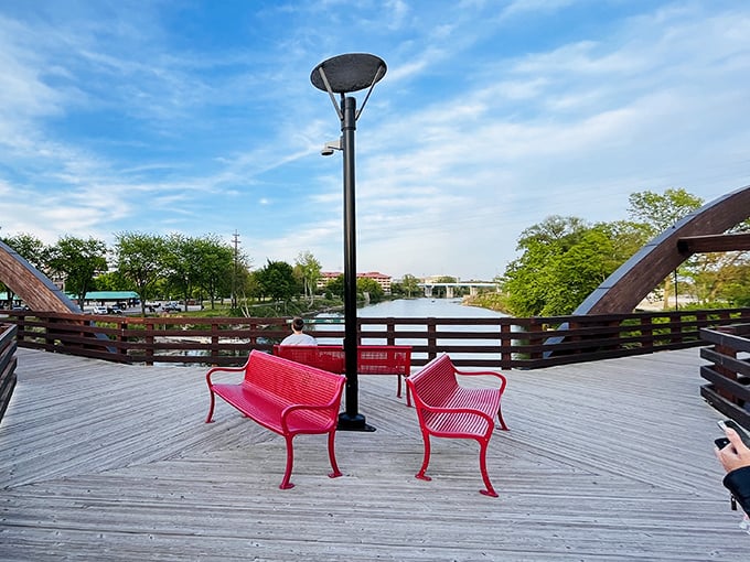 Bright red benches at the center hub invite weary travelers to pause, offering front-row seats to nature's ever-changing show.