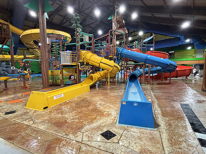 Yellow and blue water slides intertwine in a gravity-defying dance, each promising a different level of "what was I thinking?"