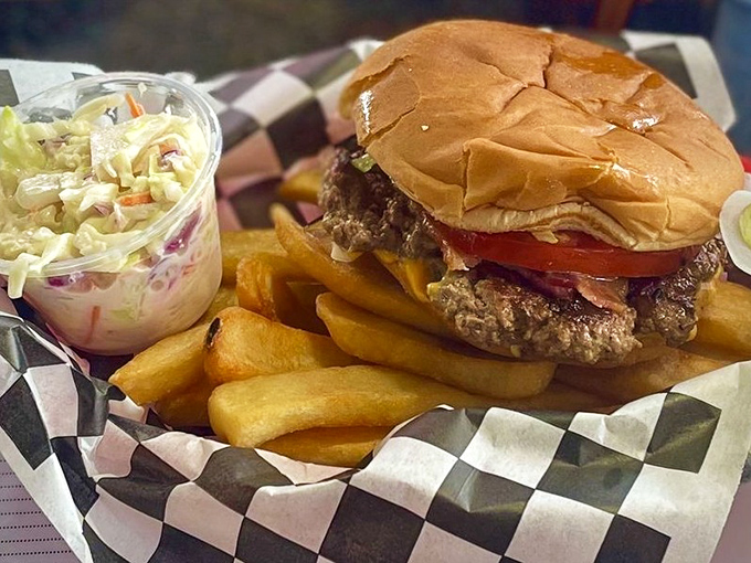 This isn't just a burger – it's edible architecture with layers of beef, cheese, and fresh toppings on a perfectly toasted bun.