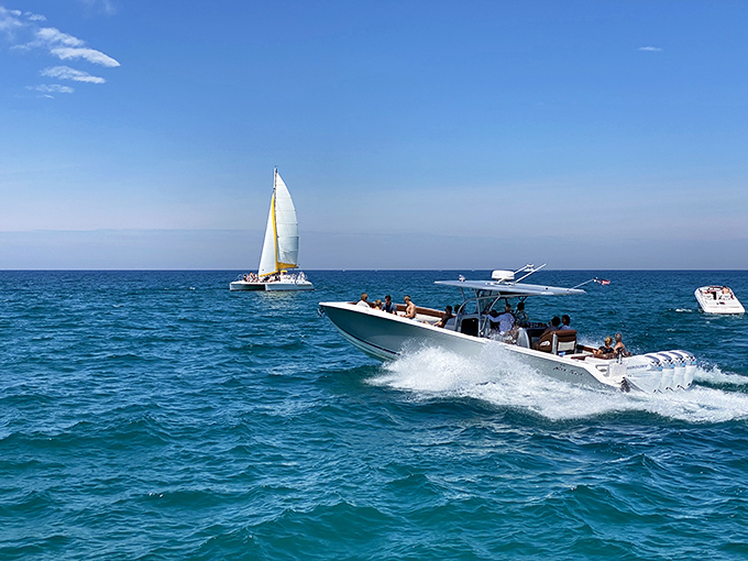 Summer freedom captured: boats carve through Lake Michigan's turquoise waters, leaving only memories and gentle wakes behind.