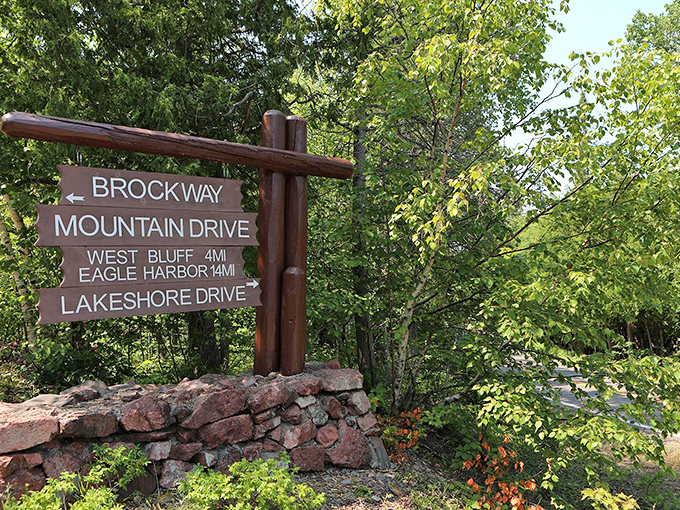 Wooden signs mark the entrance to Michigan's most spectacular road trip &ndash; no admission fee, just endless views ahead.