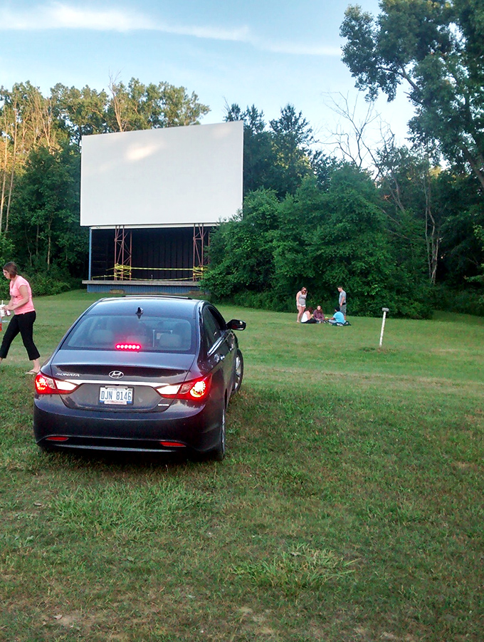 The perfect drive-in setup: a comfortable car, someone special beside you, and an unobstructed view of cinematic magic about to unfold.