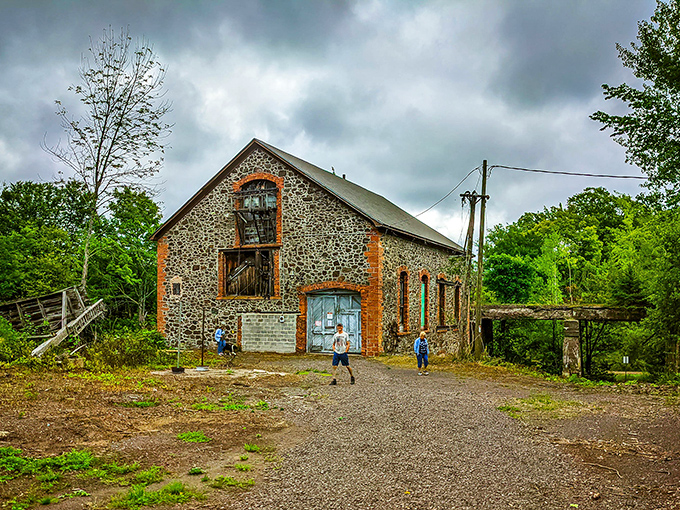 The Champion #4 Shaft-Rock House combines stone and brick craftsmanship, its weathered facade telling stories of engineering ambition from Michigan's copper boom era.