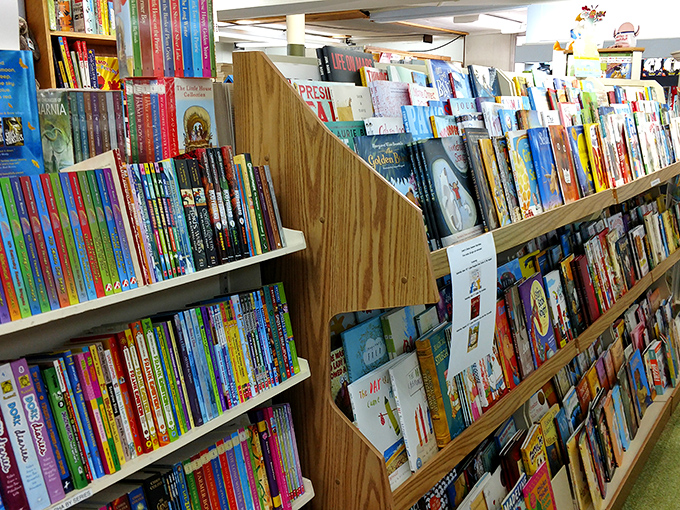 The children's section bursts with colorful spines and endless possibilities, a magical forest of stories waiting for young explorers.