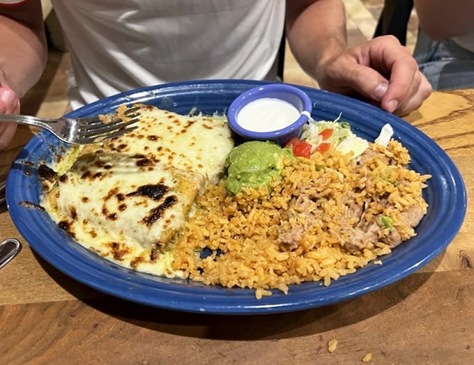 This chimichanga isn't just dinner, it's architecture&mdash;crispy exterior giving way to tender filling, with rice and beans standing by for backup.