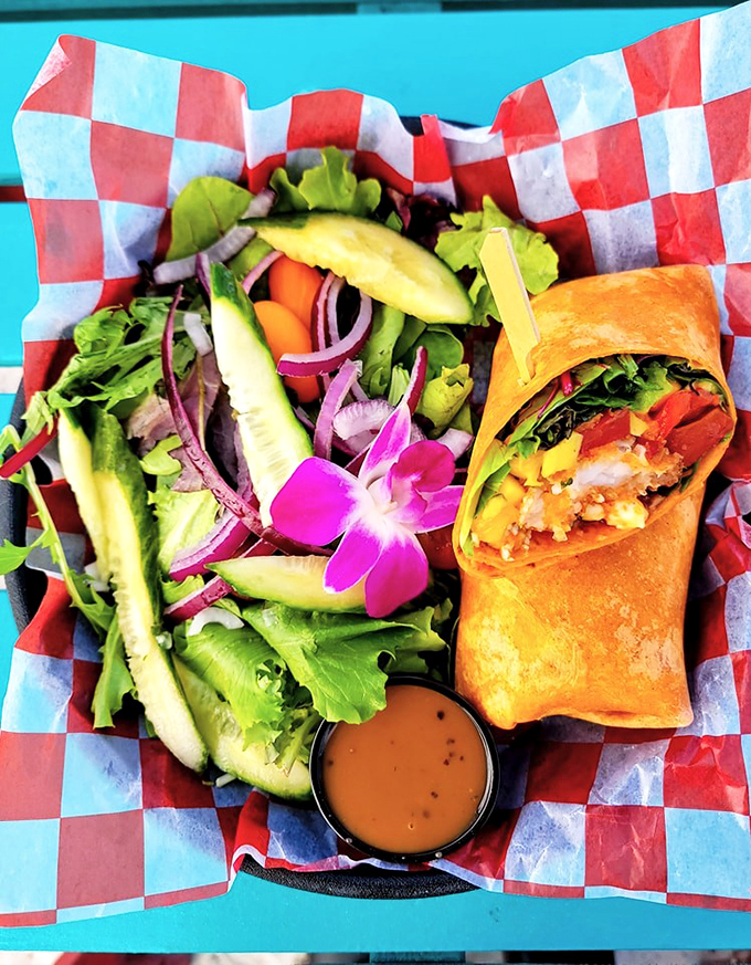 Not just any wrap &ndash; a masterclass in texture and flavor. The coconut shrimp wrap arrives with a tropical salad that's practically wearing a Hawaiian shirt.