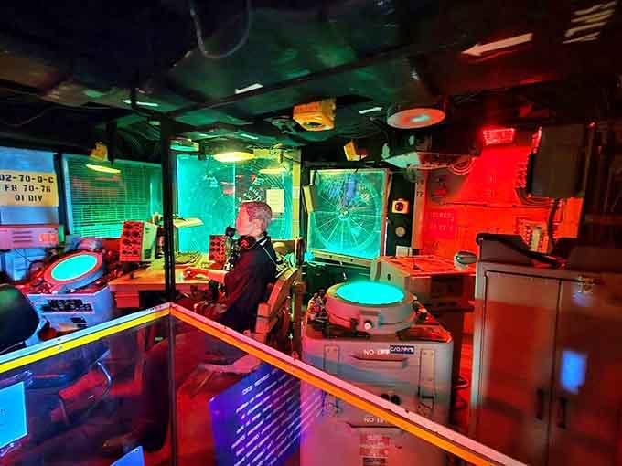 Bathed in eerie red lighting, the Combat Information Center once tracked potential threats with technology that now seems charmingly antiquated.