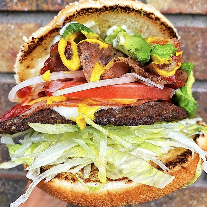 The legendary Del Gordo burger stands tall and proud, a towering masterpiece of beef, bacon, avocado, and special sauce.