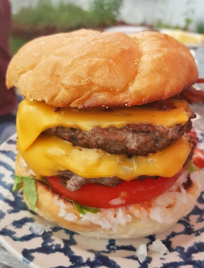 Double Cheeseburger with Bacon: Behold the architecture of perfection &ndash; two hand-formed patties, melty cheese, and bacon that makes vegetarians question their life choices.